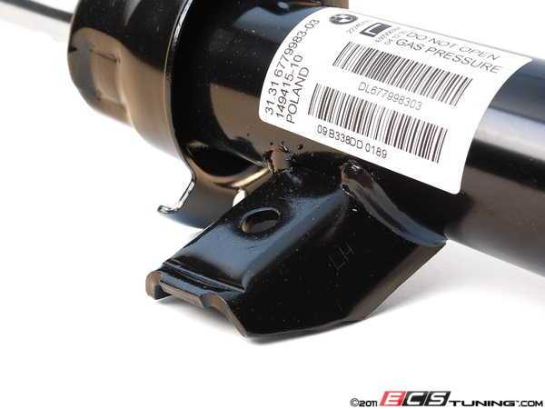 Genuine BMW - 31316779983 - Front Strut Assembly - Left (31-31-6-779-983)